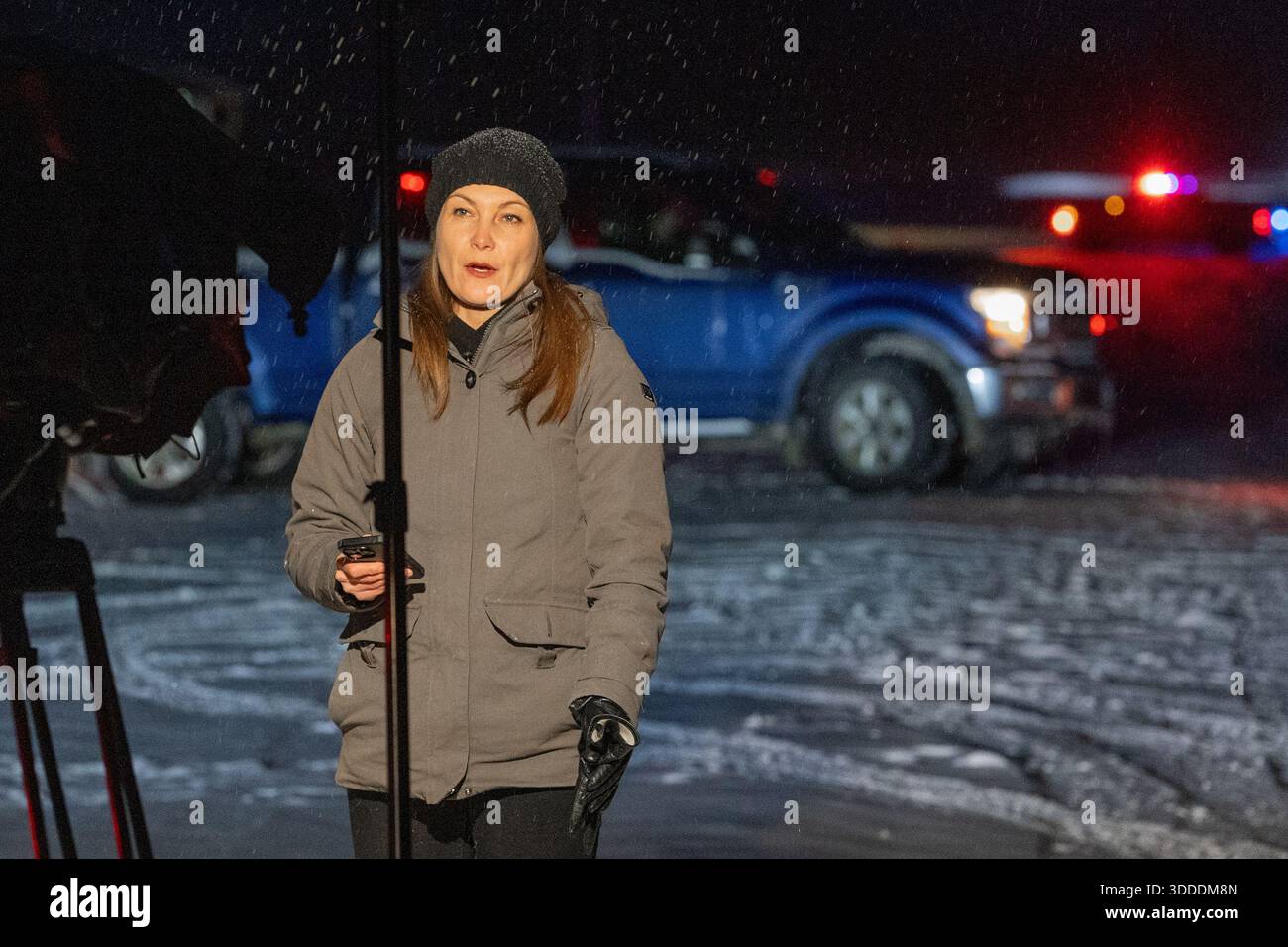 A member of the media is shown at a RCMP road blockade at Big Island ...