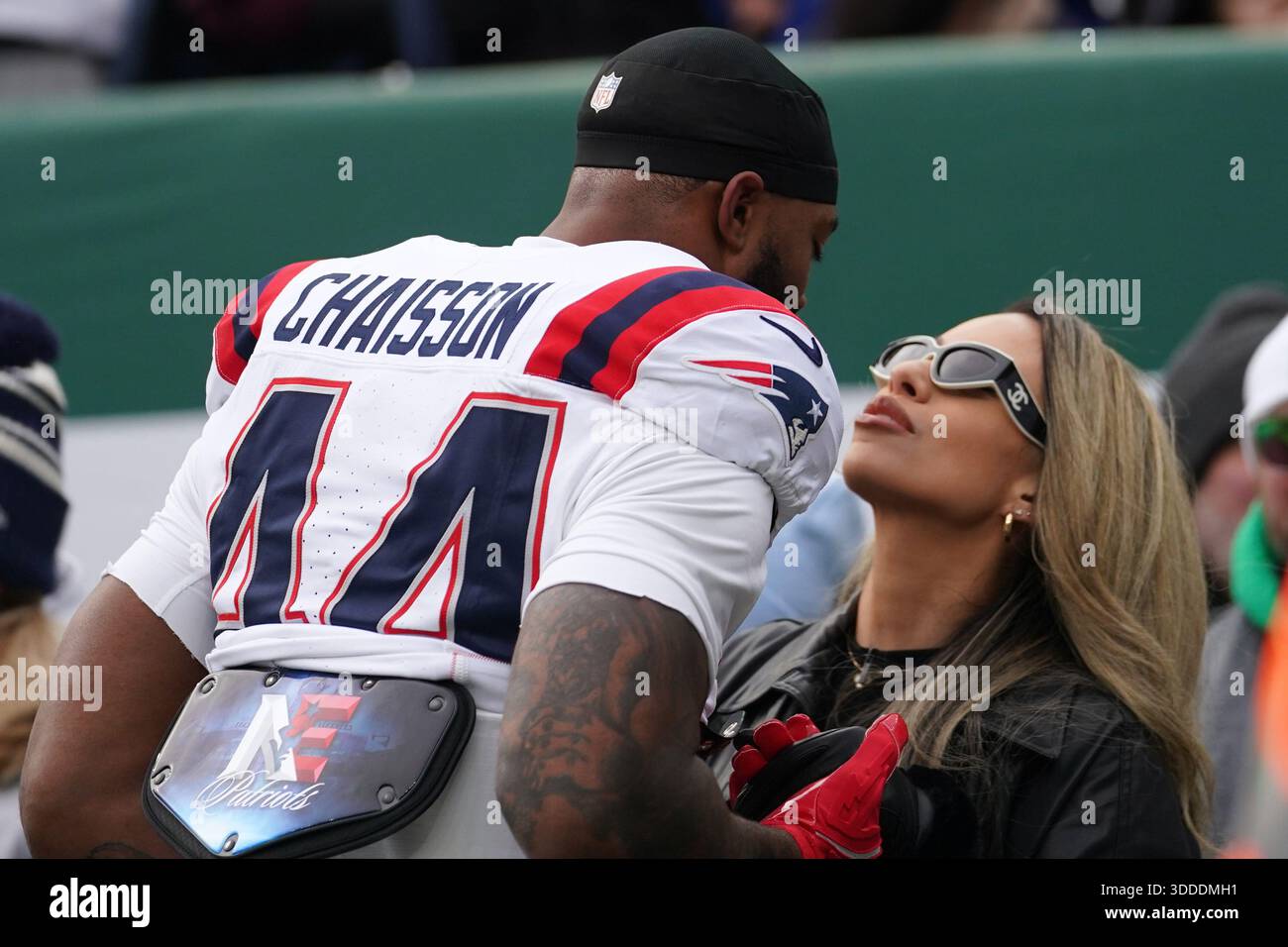 New England Patriots linebacker K'Lavon Chaisson (44) embraces Keilani ...