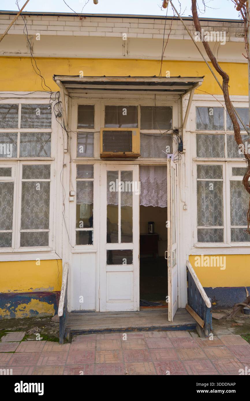 Yellow exterior and front courtyard of the temple. At the Bukharan Jews ...