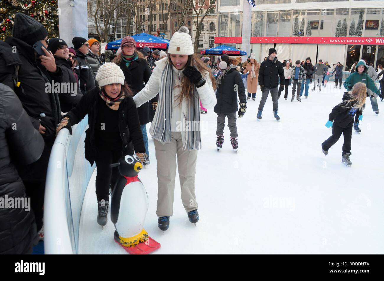 People ice skate in Bryant Park Winter Village, a seasonal holiday ...
