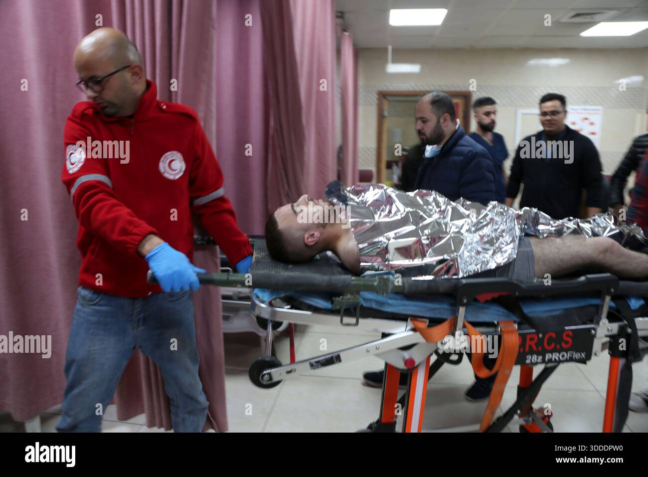 Palestinian medics evacuated a wounded Palestinian man after the ...