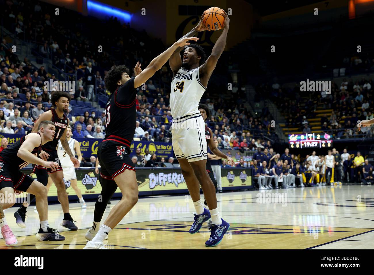 California forward Lee Dort (34) shoots against Louisville forward ...
