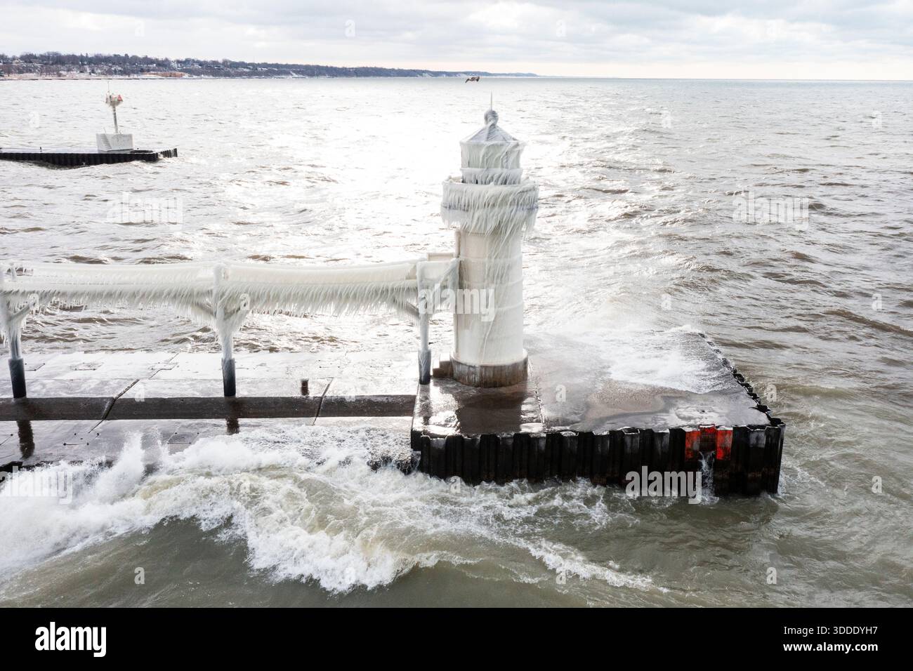 Ice covers the North Pier Outer Lighthouse at Tiscornia Park in St ...