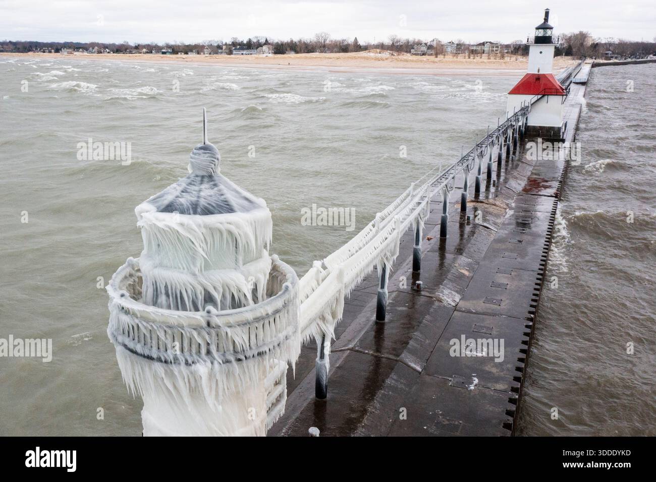 Ice covers the the North Pier Outer Lighthouse at Tiscornia Park in St ...