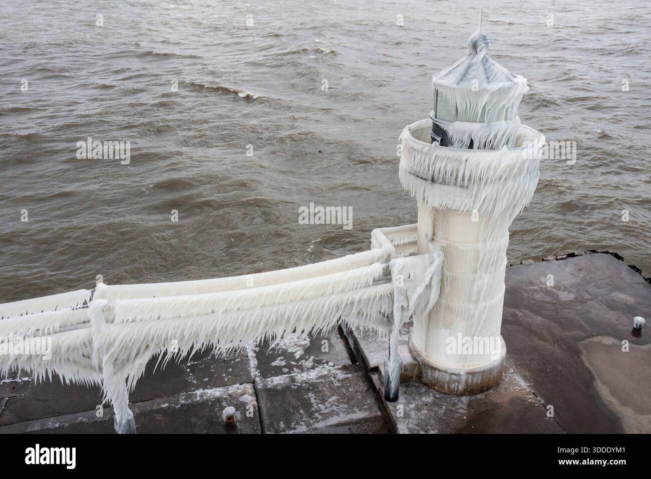 Ice covers the North Pier Outer Lighthouse at Tiscornia Park in St ...
