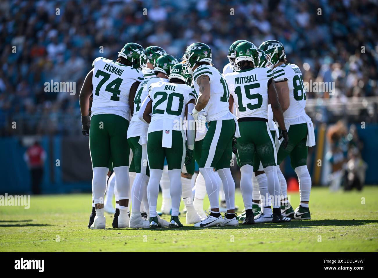 New York Jets quarterback Brady Cook (4) calls a play in the huddle ...