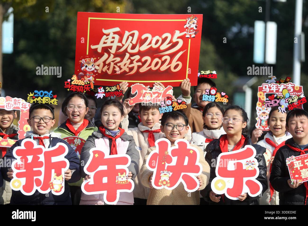 Children hold themed signs to welcome the New Year in Yangzhou City ...