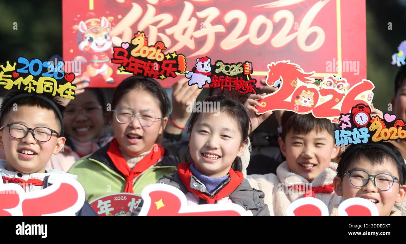 Children hold themed signs to welcome the New Year in Yangzhou City ...