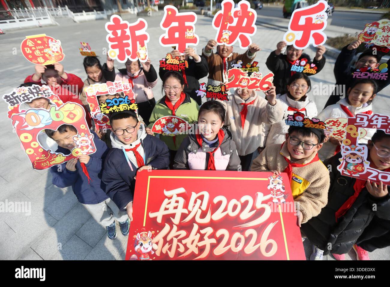 Children hold themed signs to welcome the New Year in Yangzhou City ...