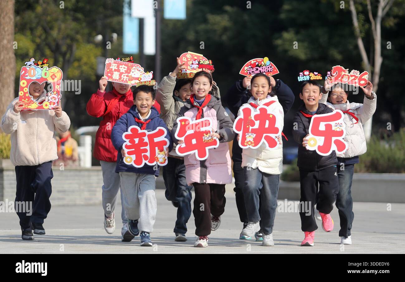 Children hold themed signs to welcome the New Year in Yangzhou City ...
