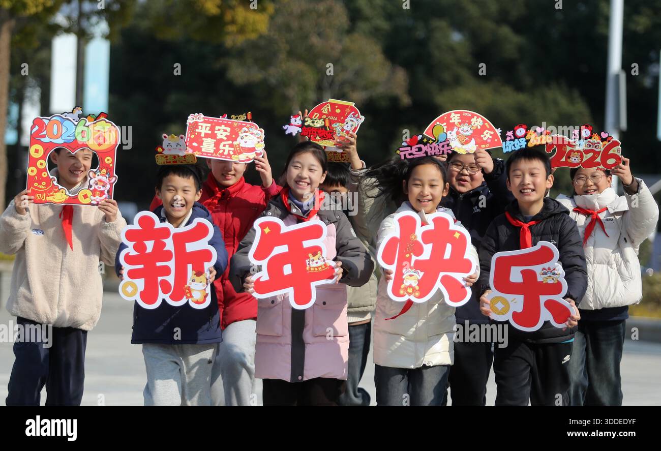 Children hold themed signs to welcome the New Year in Yangzhou City ...
