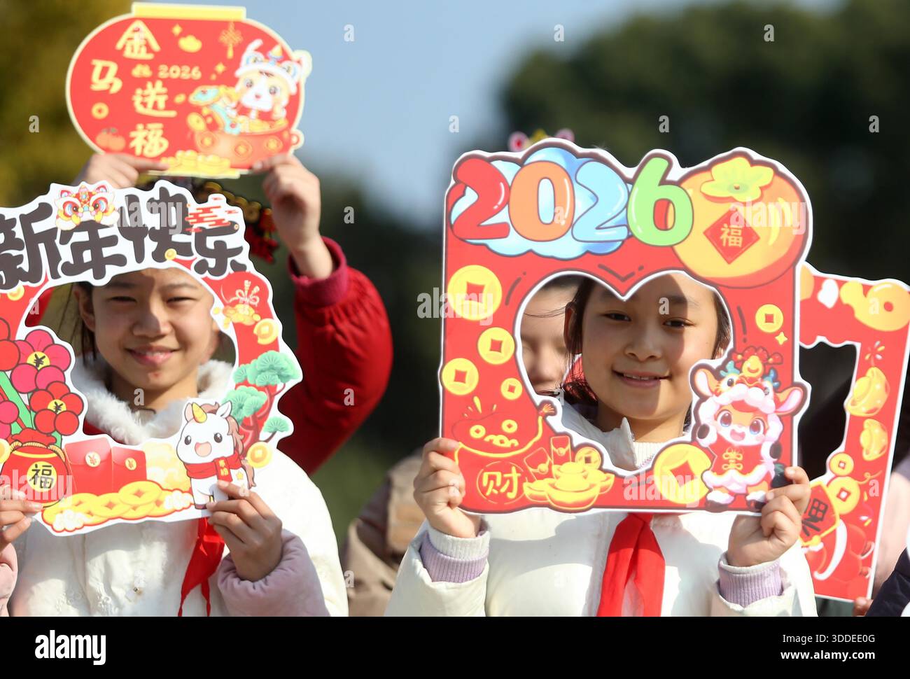 Children hold themed signs to welcome the New Year in Yangzhou City ...