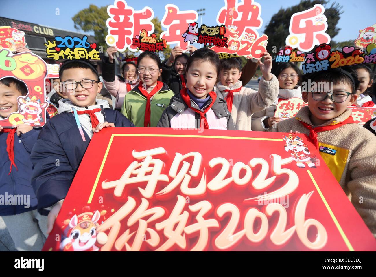 Children hold themed signs to welcome the New Year in Yangzhou City ...
