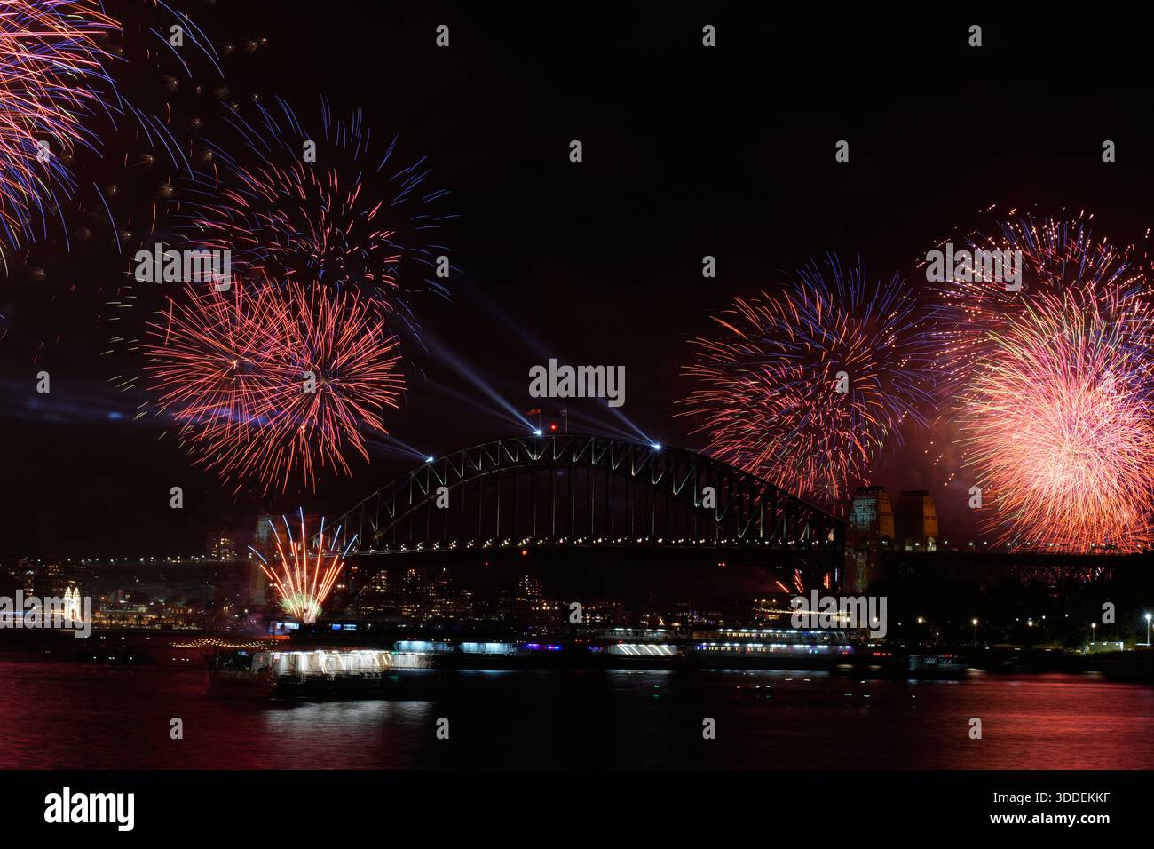 Fireworks burst over the Sydney Harbour Bridge as New Year's ...