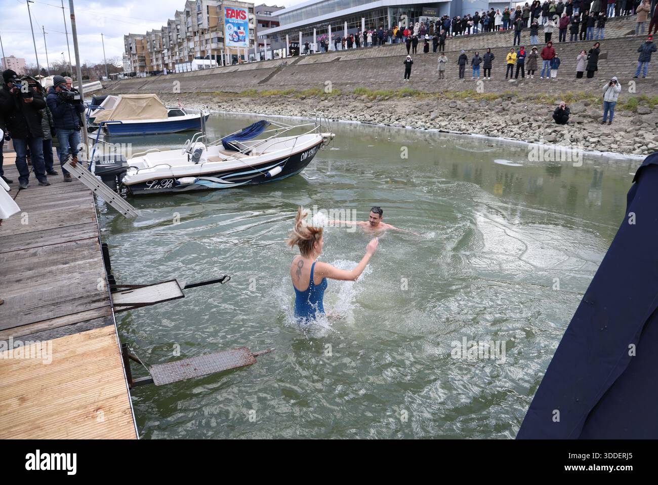 People take part in winter swimming on New Year's Eve in River Drava in ...