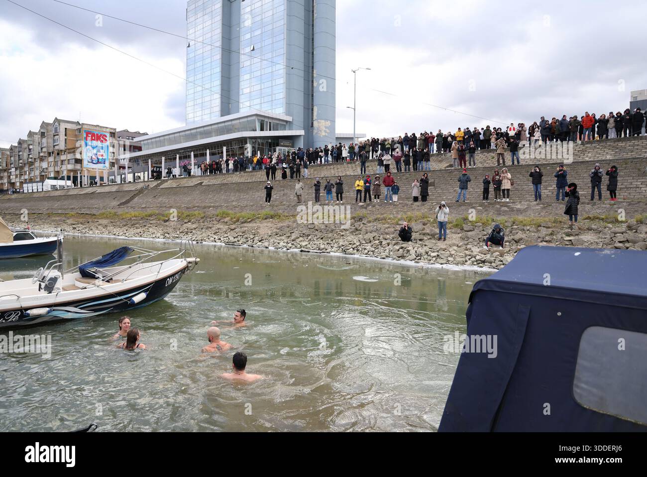 People take part in winter swimming on New Year's Eve in River Drava in ...