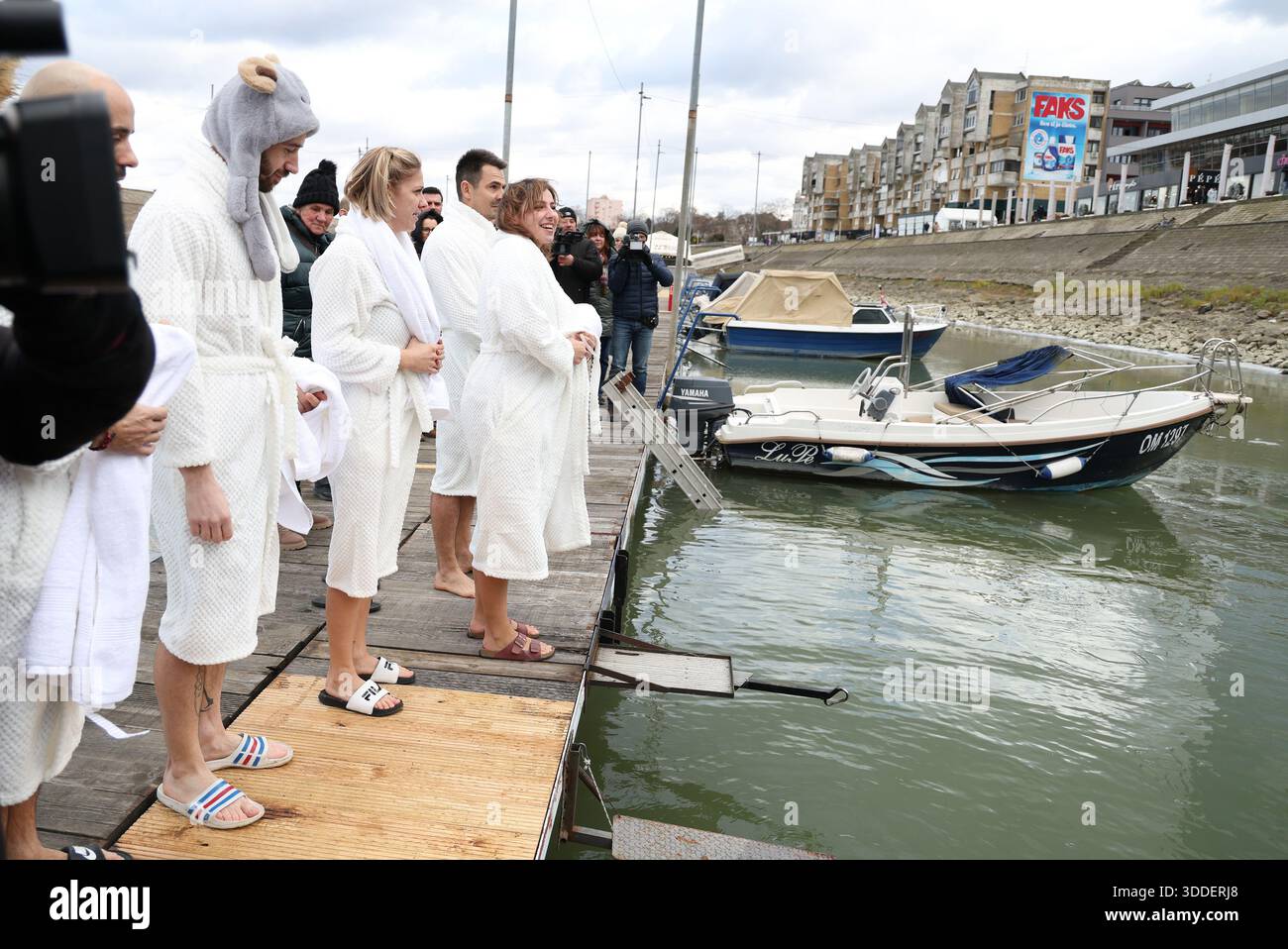 People take part in winter swimming on New Year's Eve in River Drava in ...