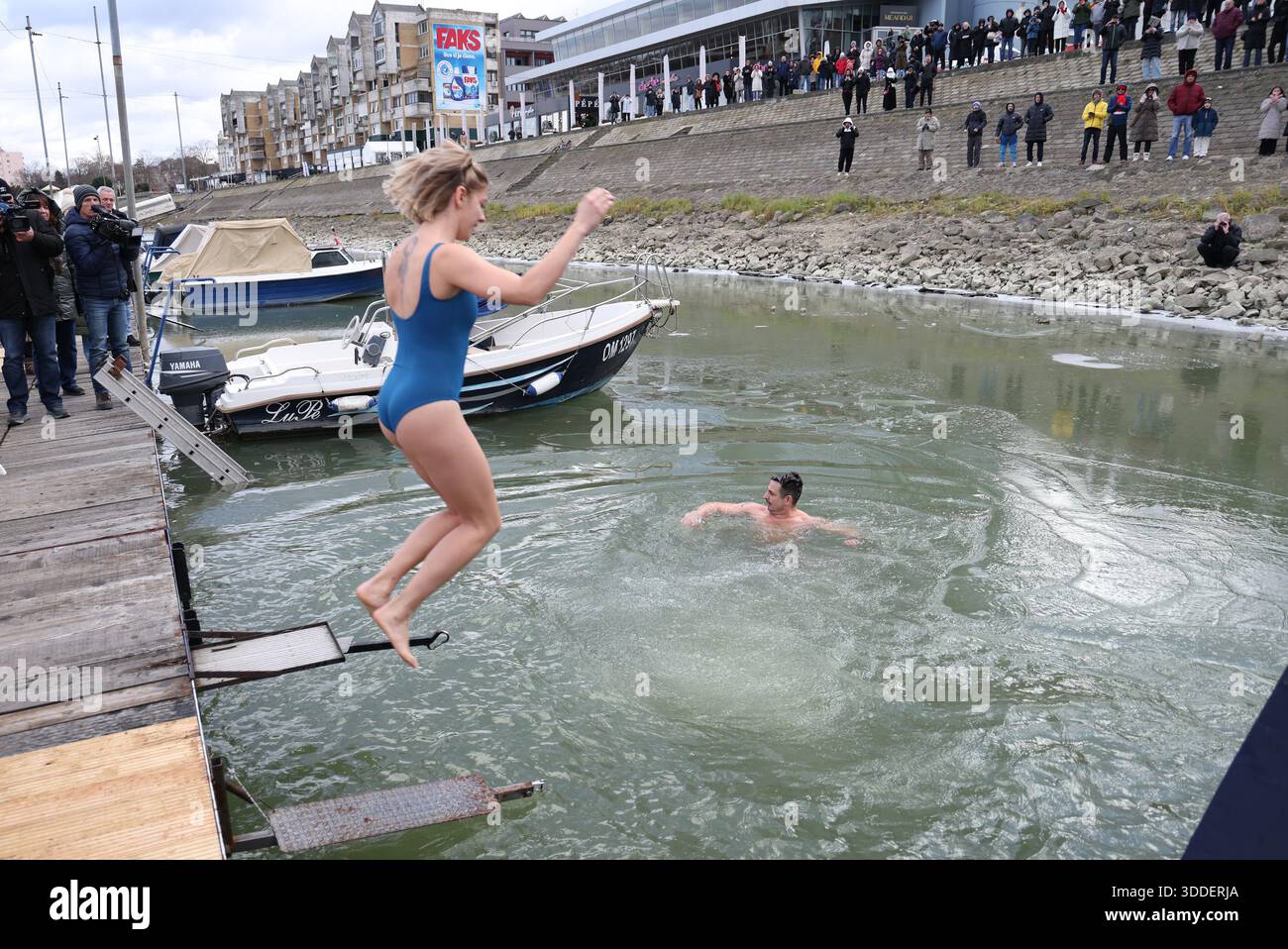 People take part in winter swimming on New Year's Eve in River Drava in ...