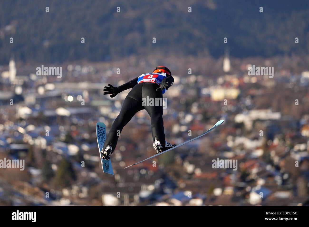 Selina Freitag, of Germany, soars through the air during her first ...