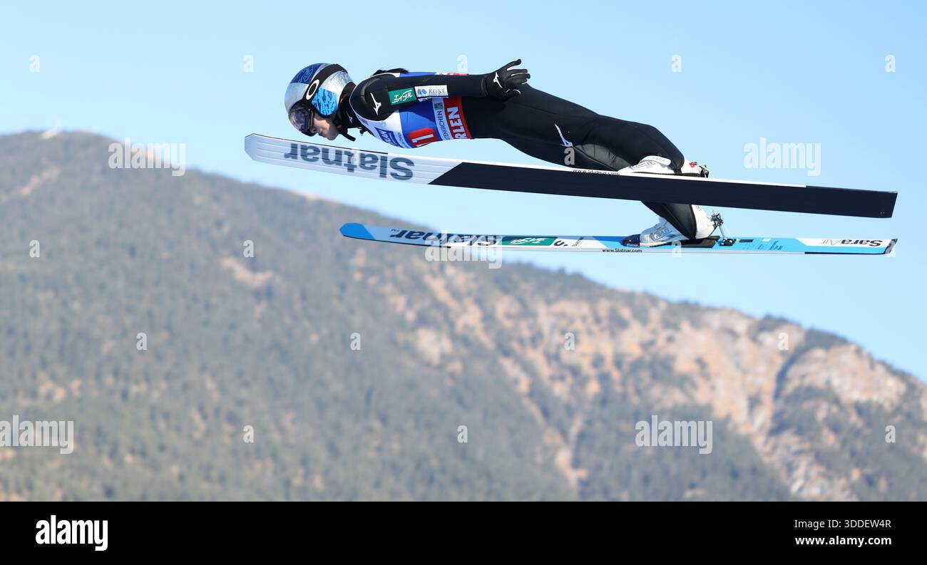 Sara Takanashi of Japan soars in the air during round 1 of the women's ...