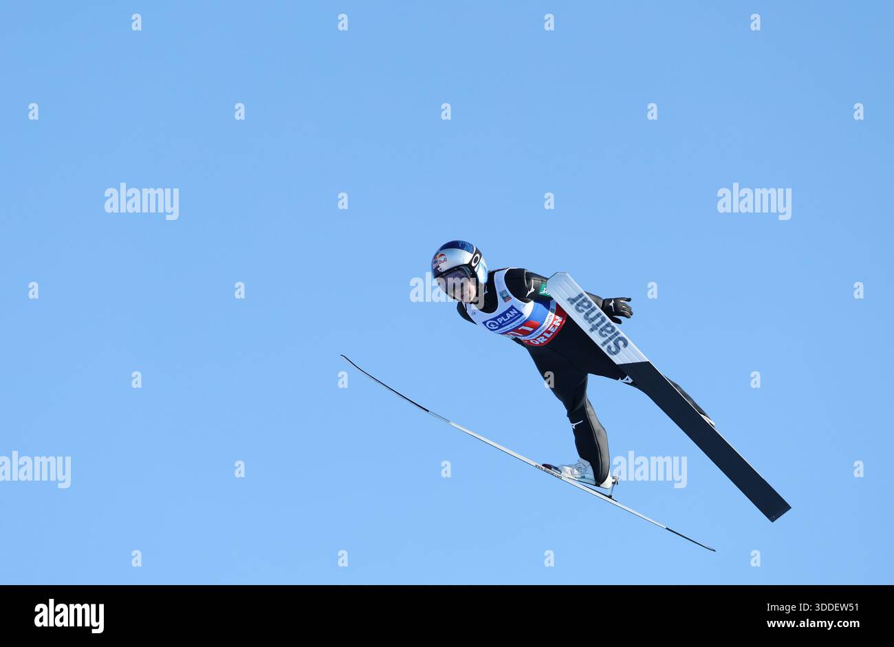Sara Takanashi of Japan soars in the air during round 1 of the women's ...