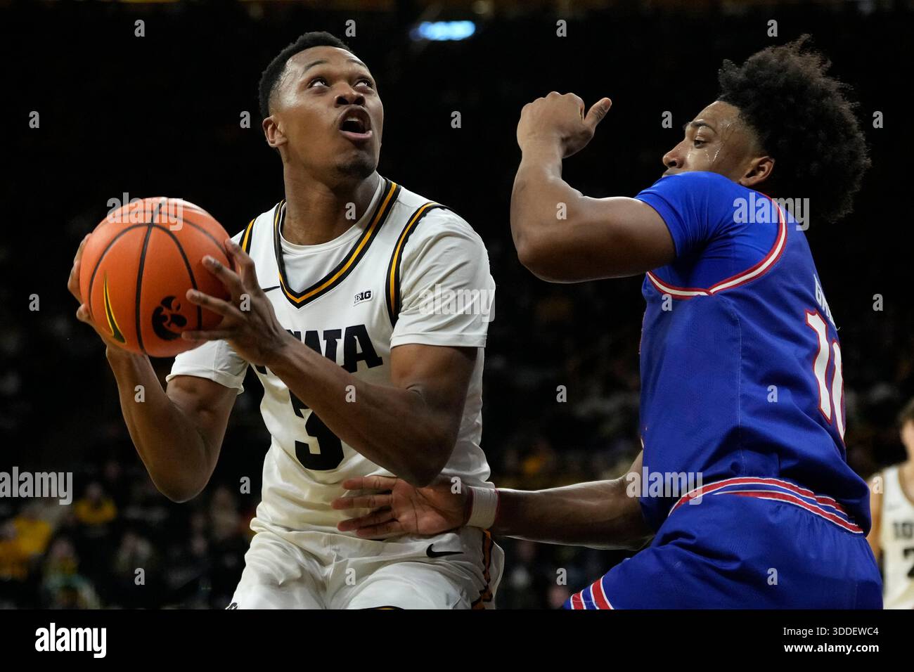 Iowa forward Cam Manyawu (3) shoots over UMass-Lowell guard Xavier ...
