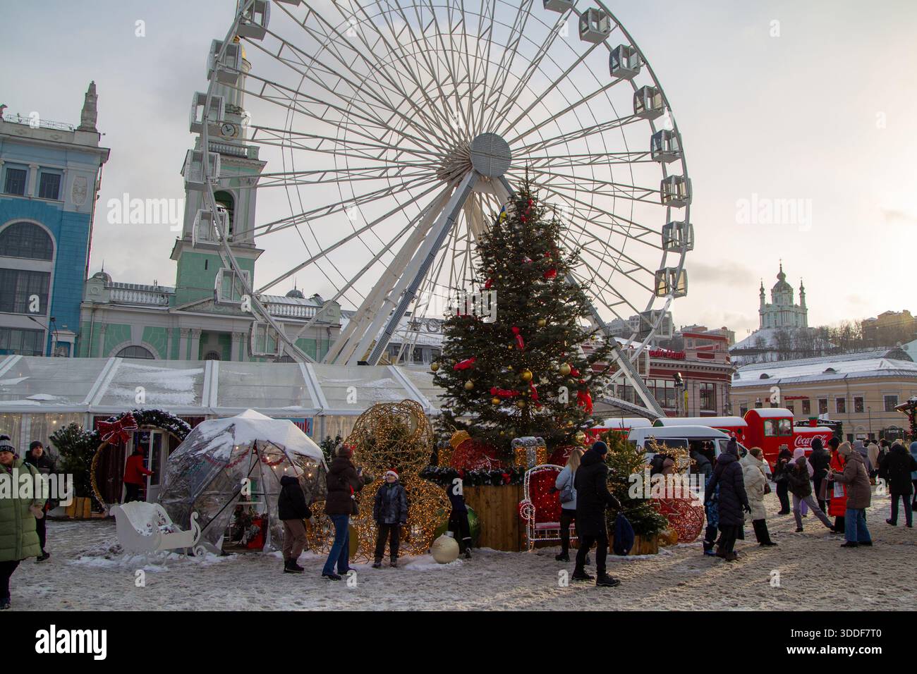 People visit the Christmas town in Kontraktova Square in Kyiv, Ukraine ...