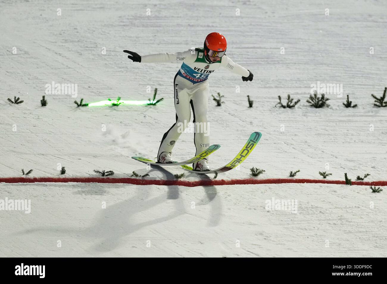 Jason Colby, of the United States, lands his qualification jump at the ...