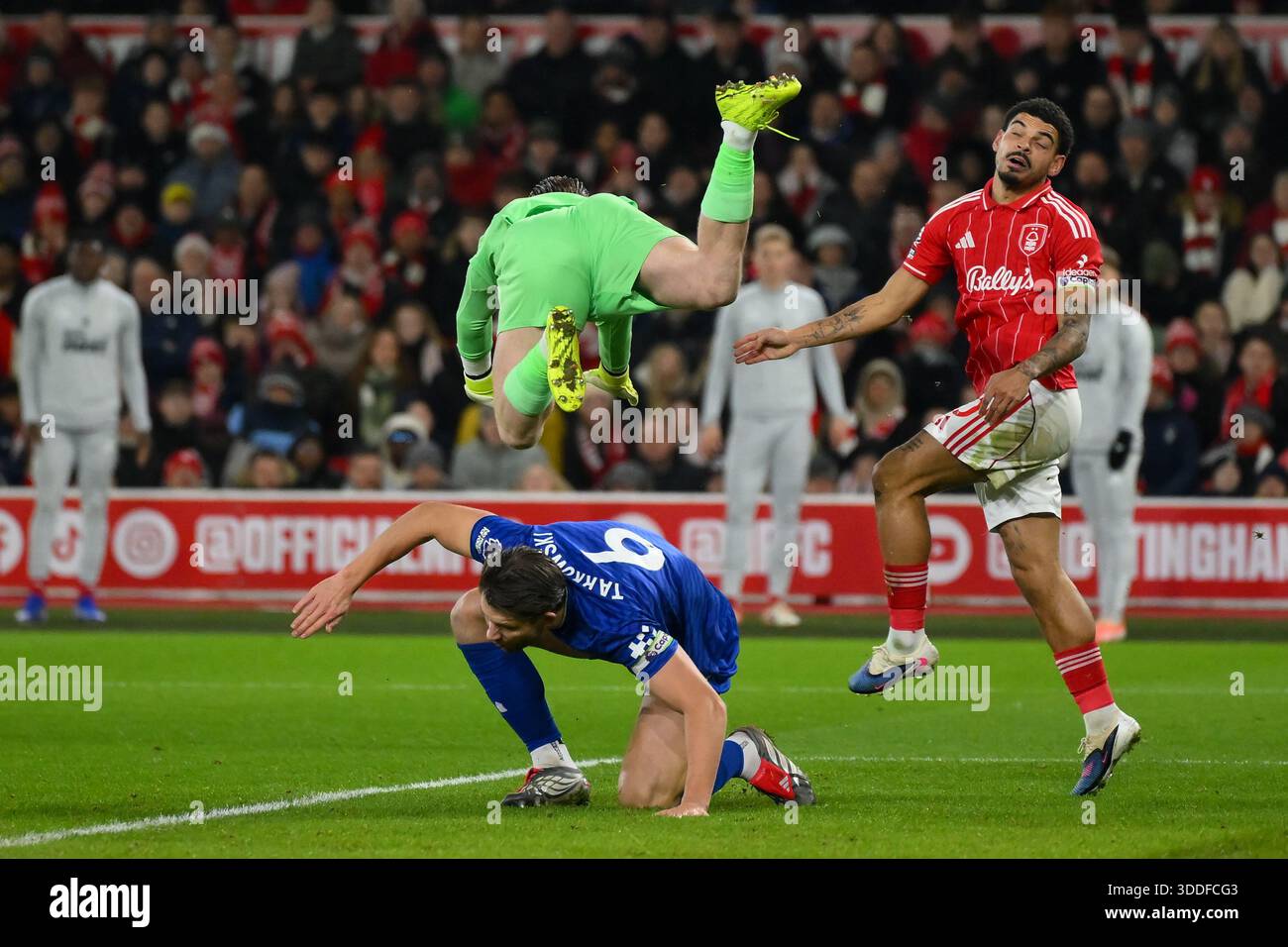 Jordan Pickford of Everton falls over James Tarkowski of Everton during ...