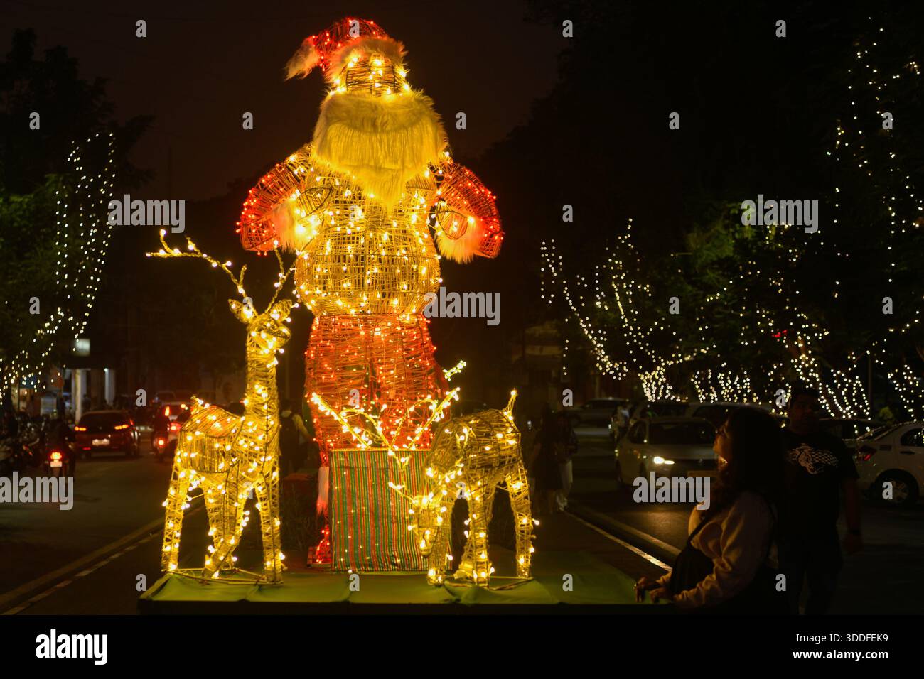 A woman looks at the decorations outside The Our Lady of the Immaculate ...