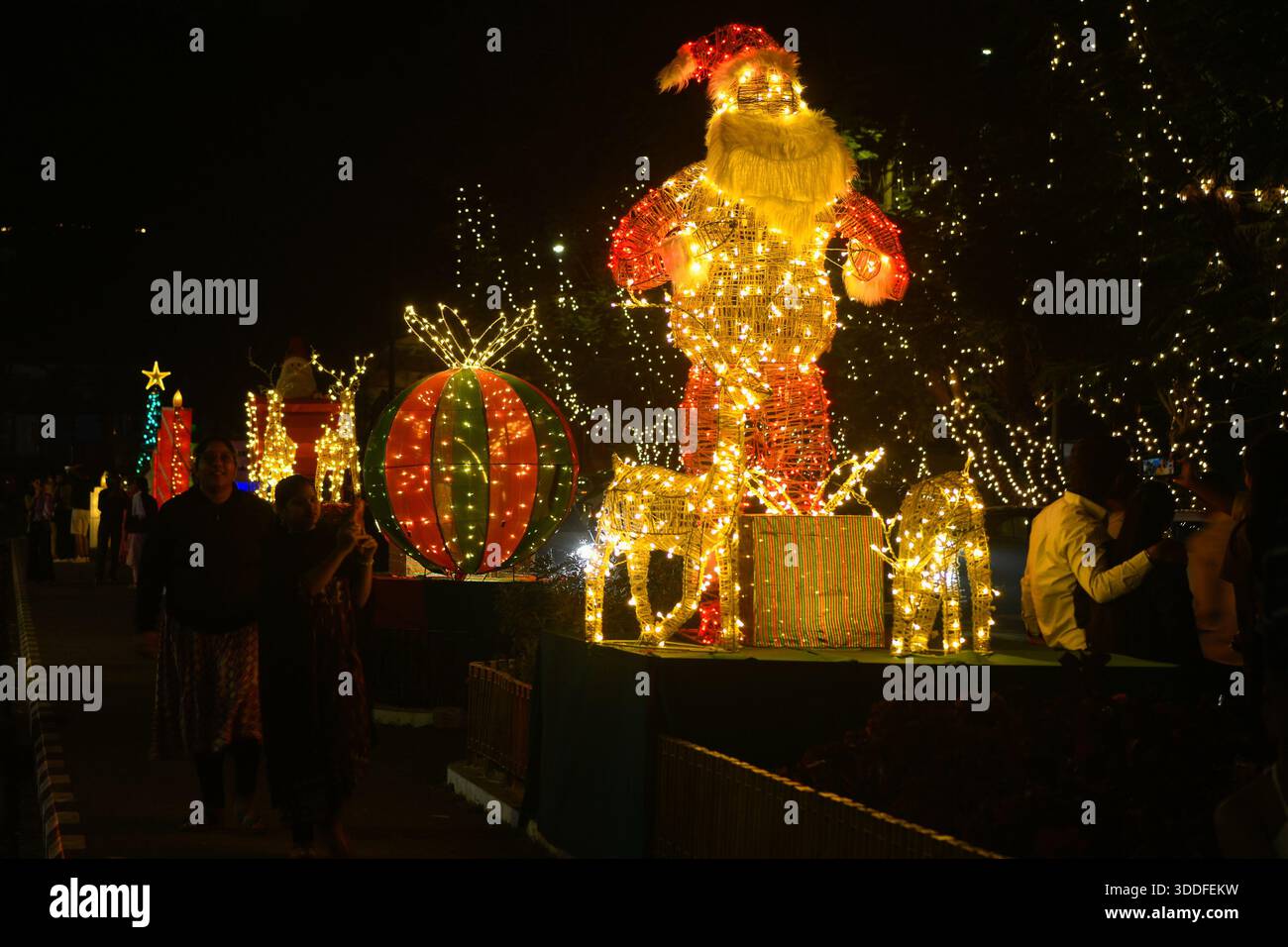 People stand near the decorations outside The Our Lady of the ...