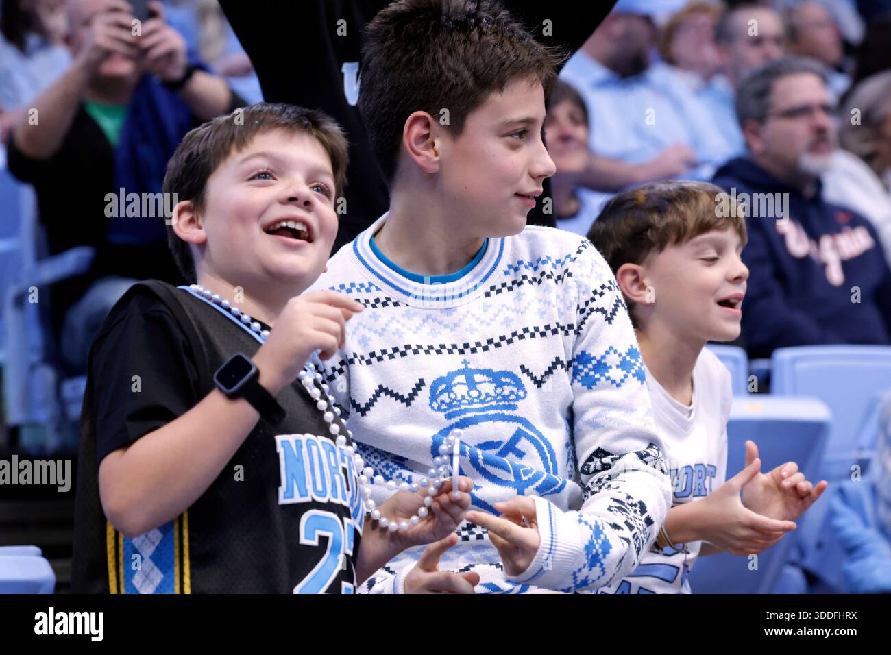 Young North Carolina fans enjoy watching the team warm up before an ...