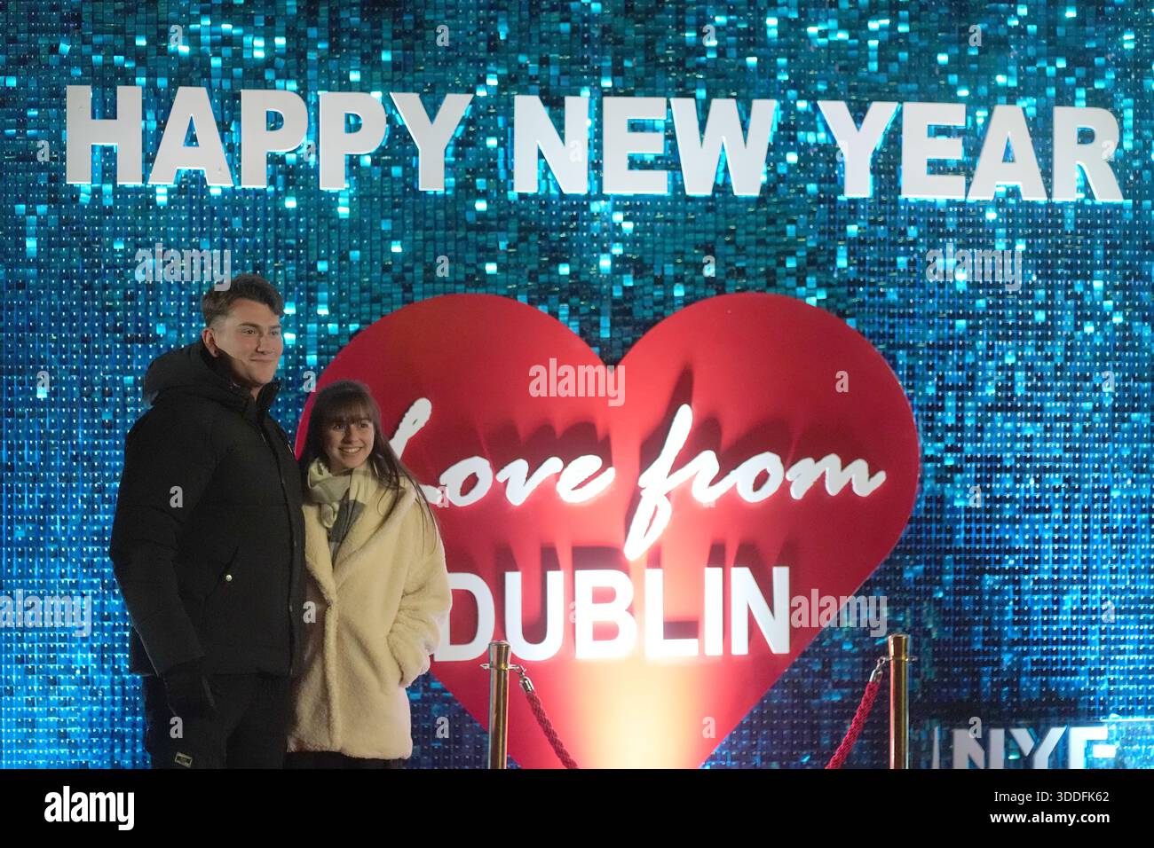 People pose for photo by a New Year sign at Dublin Castle ahead of the ...
