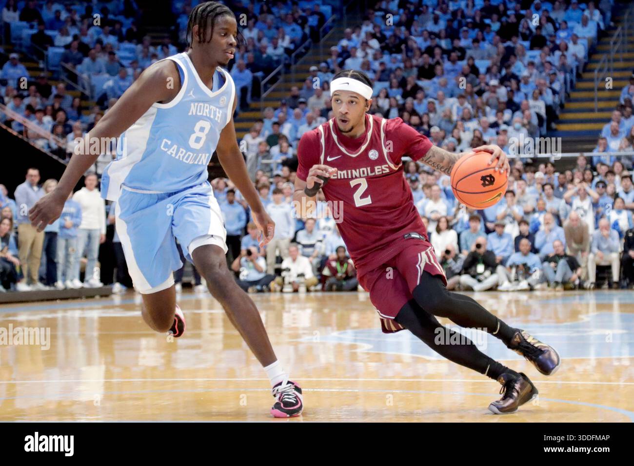 Florida State guard Cam Miles (2) drives against North Carolina forward ...