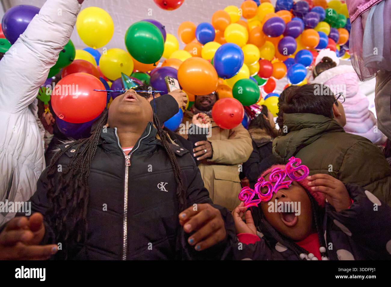 Cori Johnson, 9, left, and Kori Simms, 6, both of Washington, wear 2026 ...