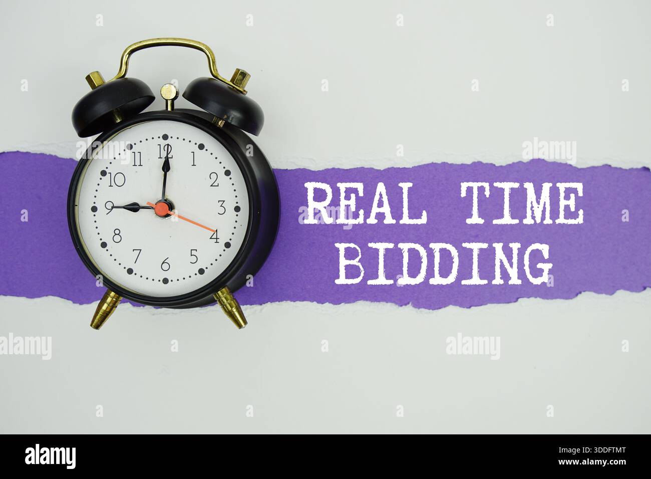 Real Time Bidding text on purple with white paper torn ripped of ...