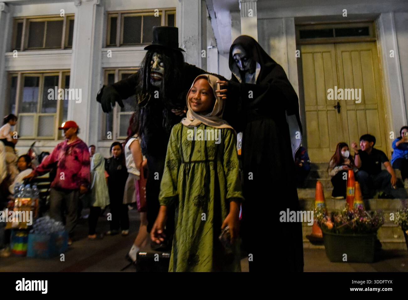 Bandung, West Java, Indonesia. 31st Dec, 2025. Ghost cosplayers pose ...