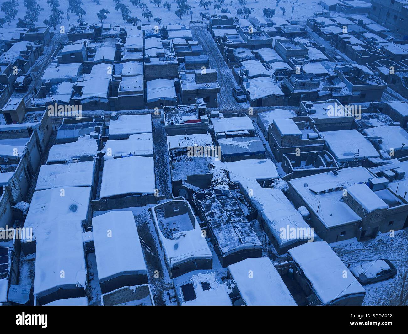31 December 2024, Syria, Idlib: An aerial view shows houses covered in ...