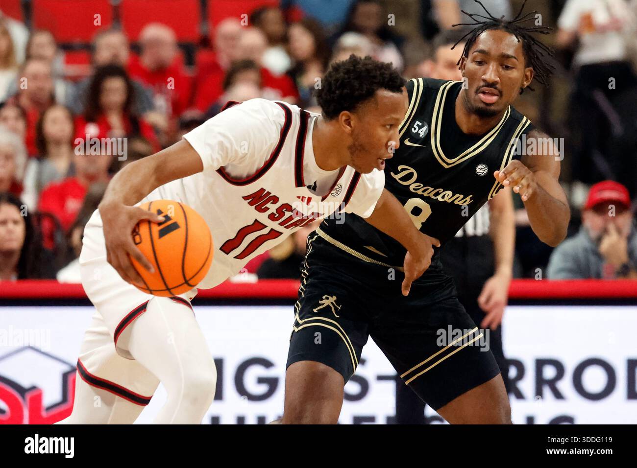 North Carolina State's Quadir Copeland (11) drives the ball around Wake ...