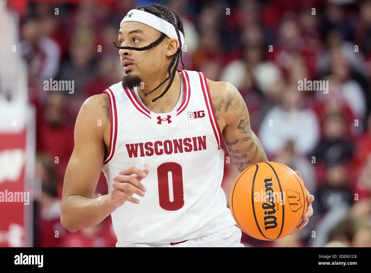 Wisconsin guard Braeden Carrington dribbles during the second half of ...