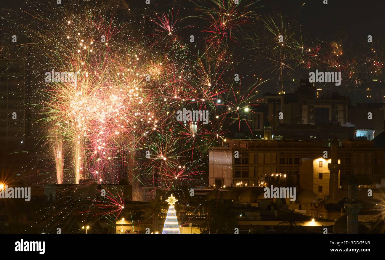 In this image shot with a slow shutter speed, fireworks light up the ...