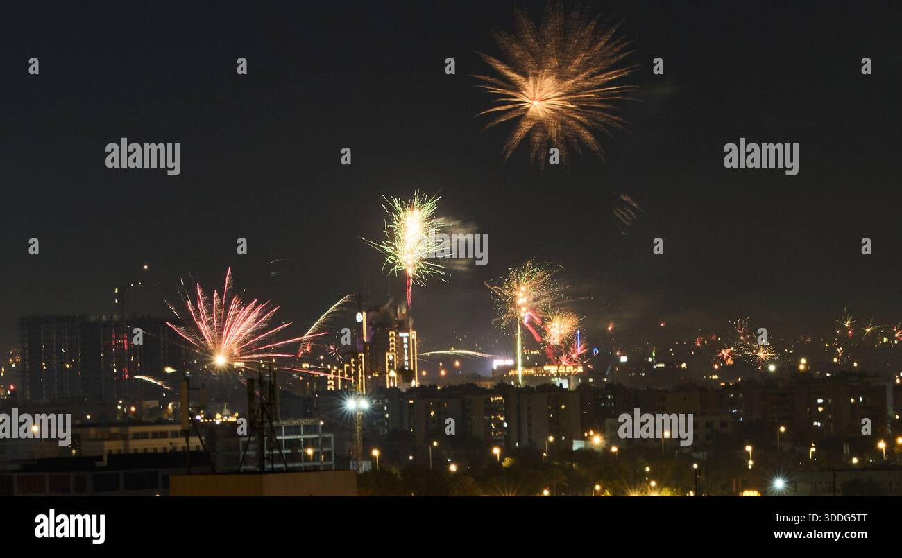 In this image shot with a slow shutter speed, fireworks light up the ...