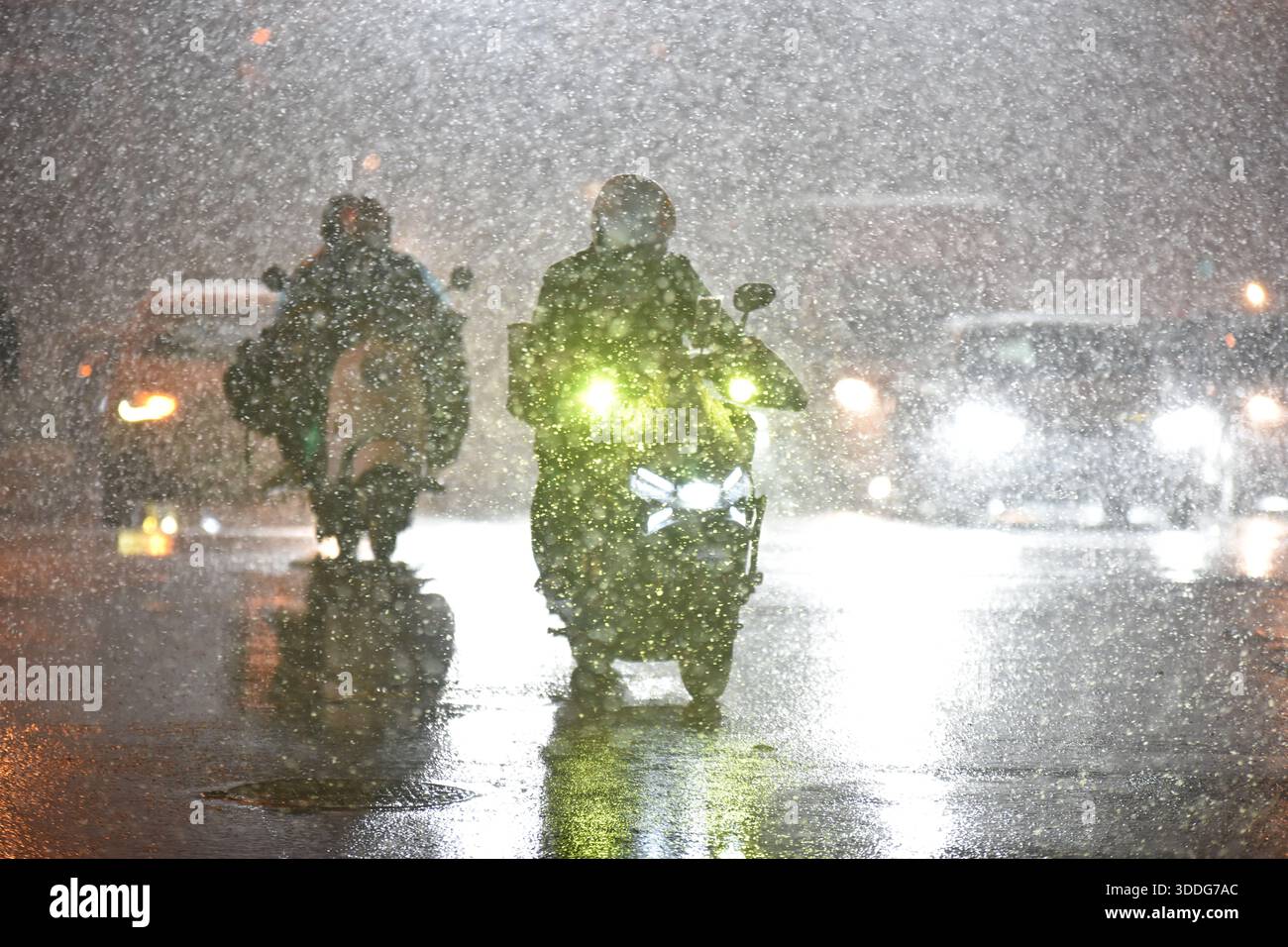 FUYANG, CHINA - DECEMBER 31, 2025 - Pedestrians braved the snow to ride ...