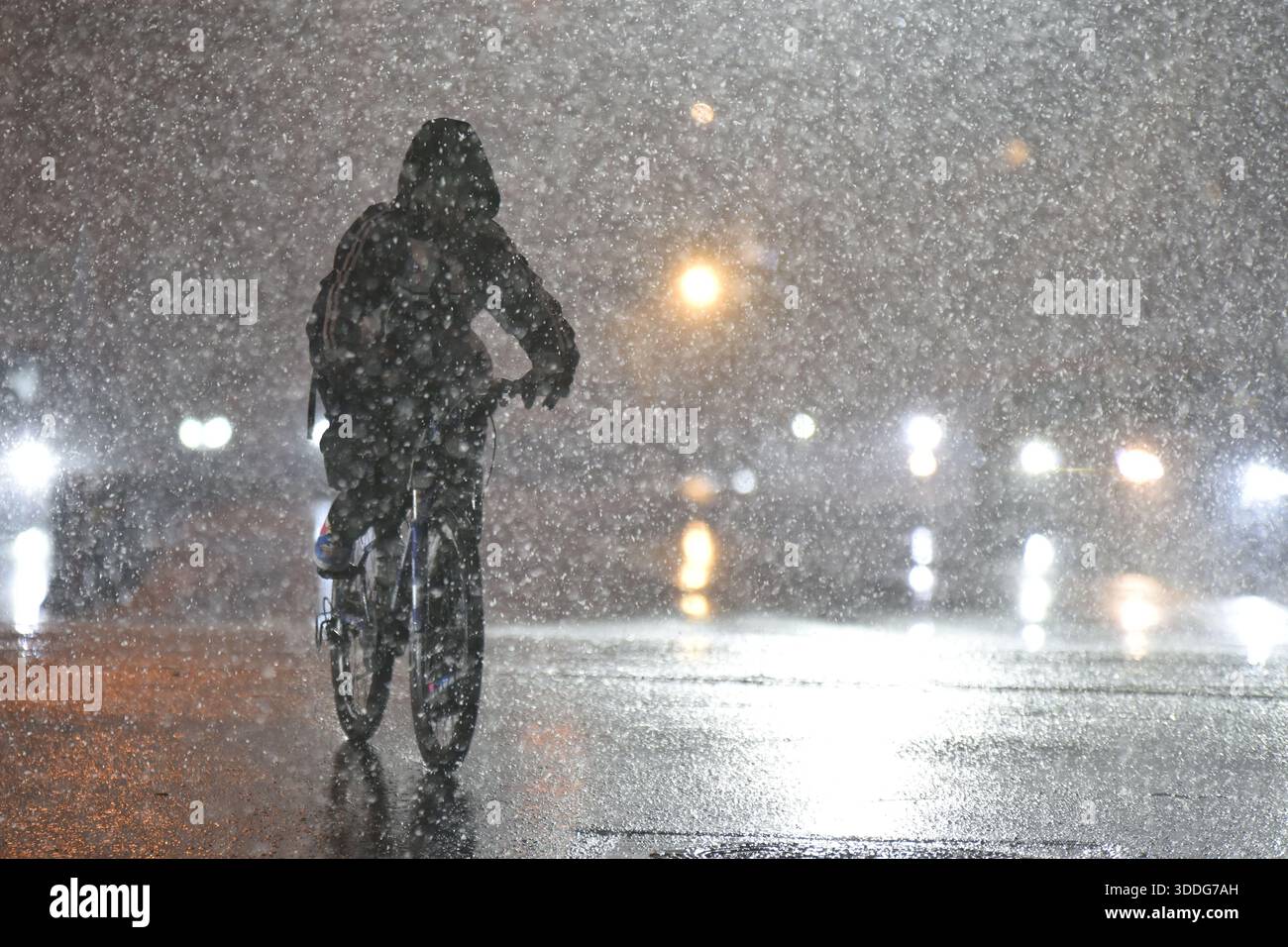 FUYANG, CHINA - DECEMBER 31, 2025 - Pedestrians braved the snow to ride ...