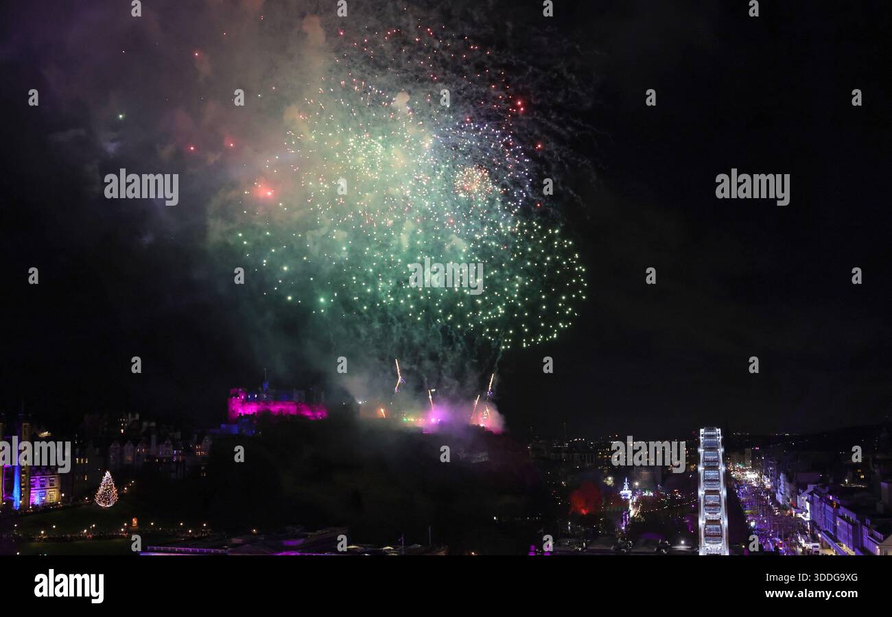Fireworks explode over Edinburgh Castle during the Hogmanay New Year ...