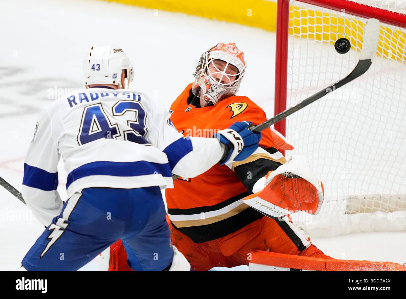 Tampa Bay Lightning defenseman Darren Raddysh, left, scores on Anaheim ...