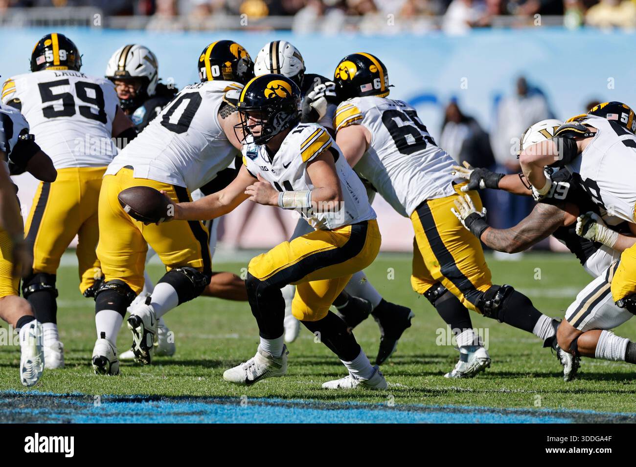 TAMPA, FL - DECEMBER 31: Mark Gronowski #11 of the Iowa Hawkeyes looks ...