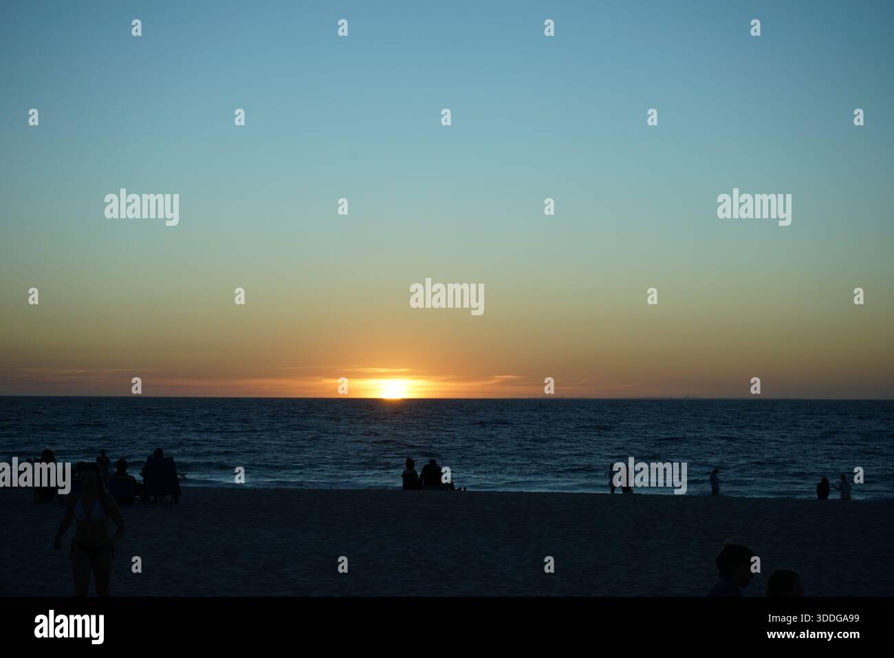 Perth, Australia - December 31, 2025: People watch the sunset on a ...