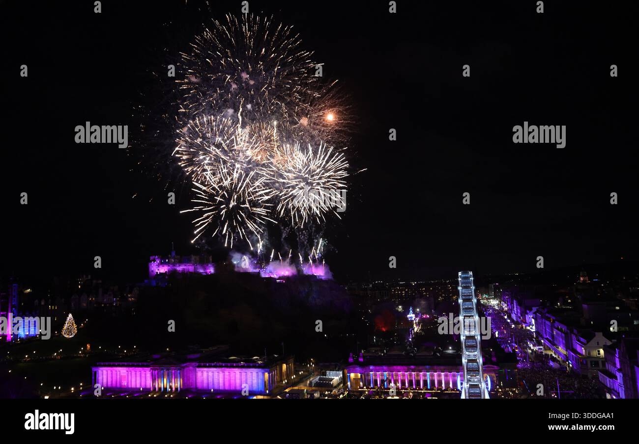 Fireworks explode over Edinburgh Castle during the Hogmanay New Year ...