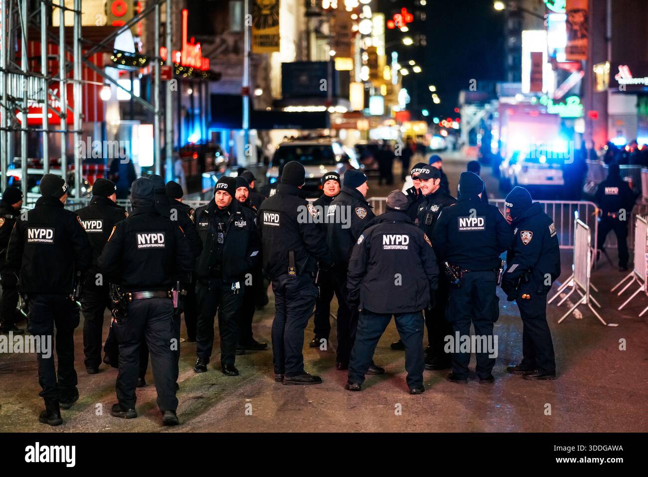 NYPD officers stand guard in Times Square during New Year's Eve ...
